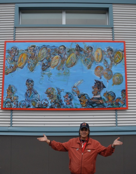 'The Drumdance Diptych Mural and artist at the Chief T'Seleie School'